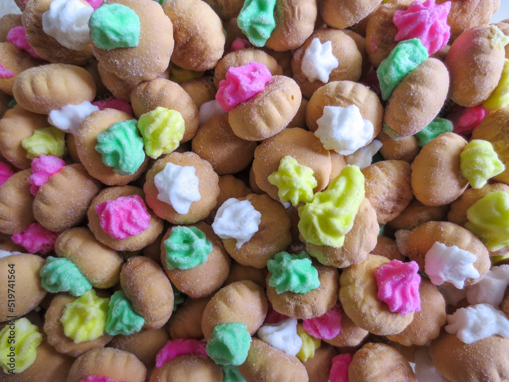 Poster Bite-sized biscuits topped with a kind of sweet, hard “icing ...