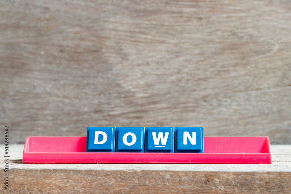 Tile letter on red rack in word down on wood background Stock Photo ...