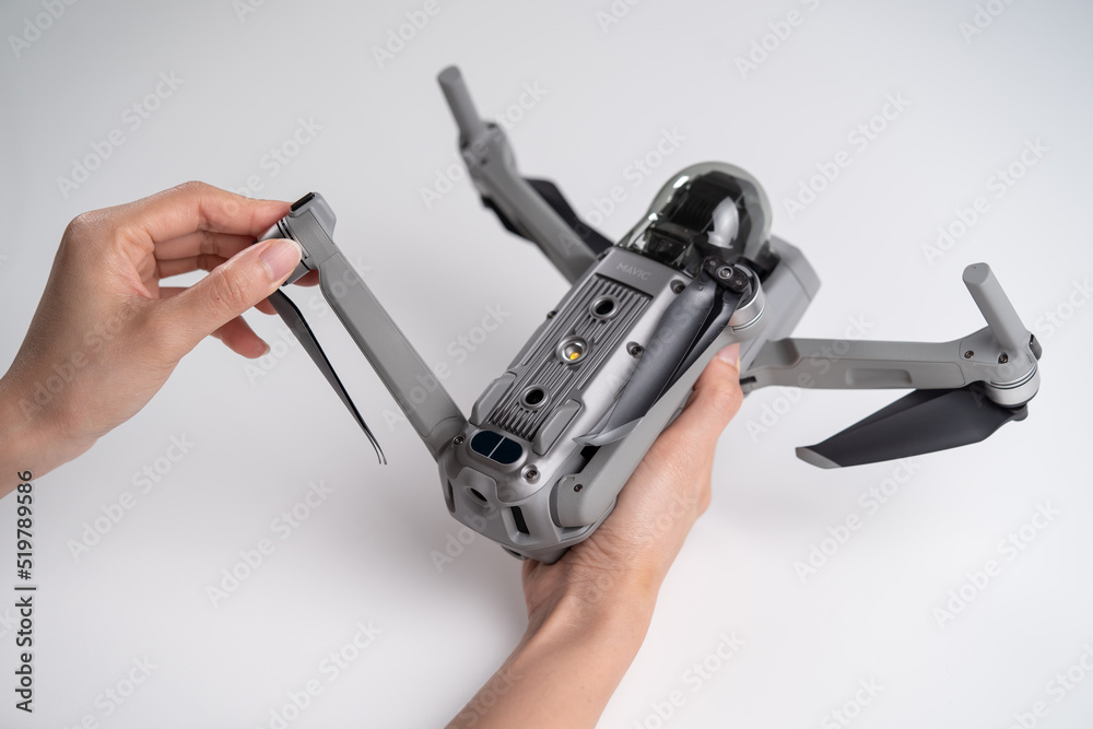 PENANG, MALAYSIA - JUL 08, 2020: Hand fold/unfold the rear arm of the ...