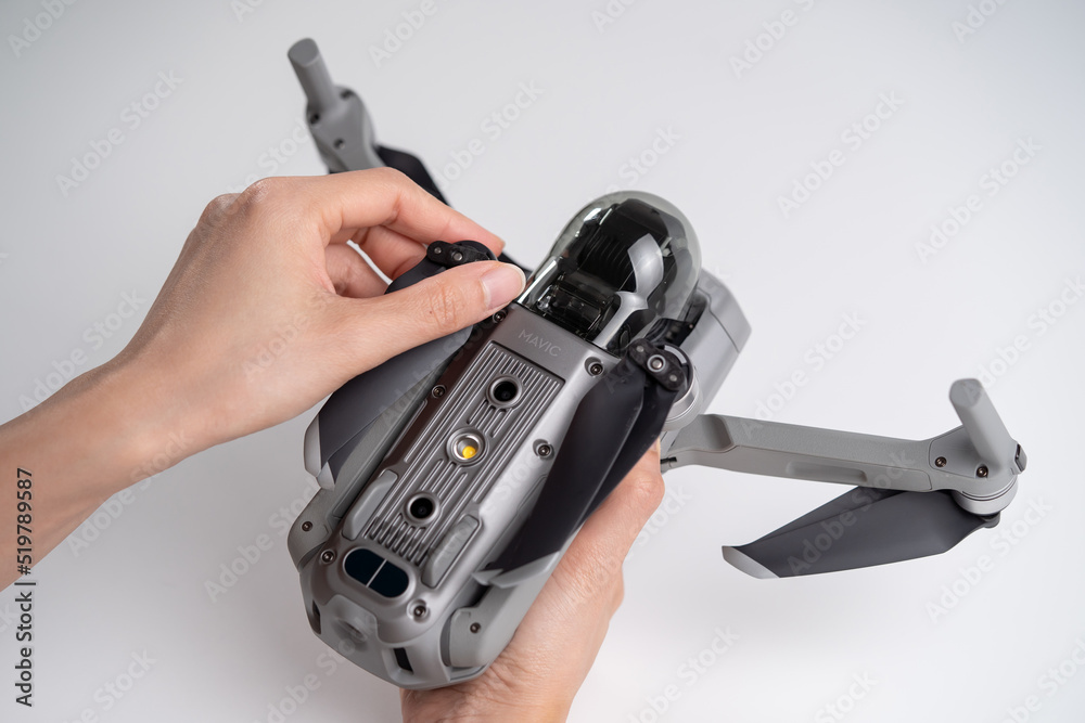 PENANG, MALAYSIA - JUL 08, 2020: Hand fold/unfold the rear arm of the ...