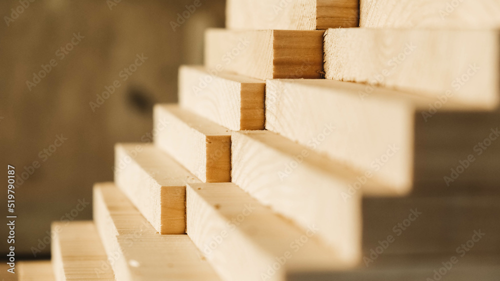 Stacked wooden carpentry boards from natural wood in a woodworking ...