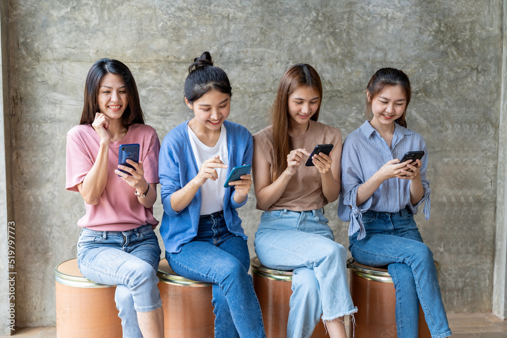 Beautiful Asian woman using a smartphone to fill out information and ...