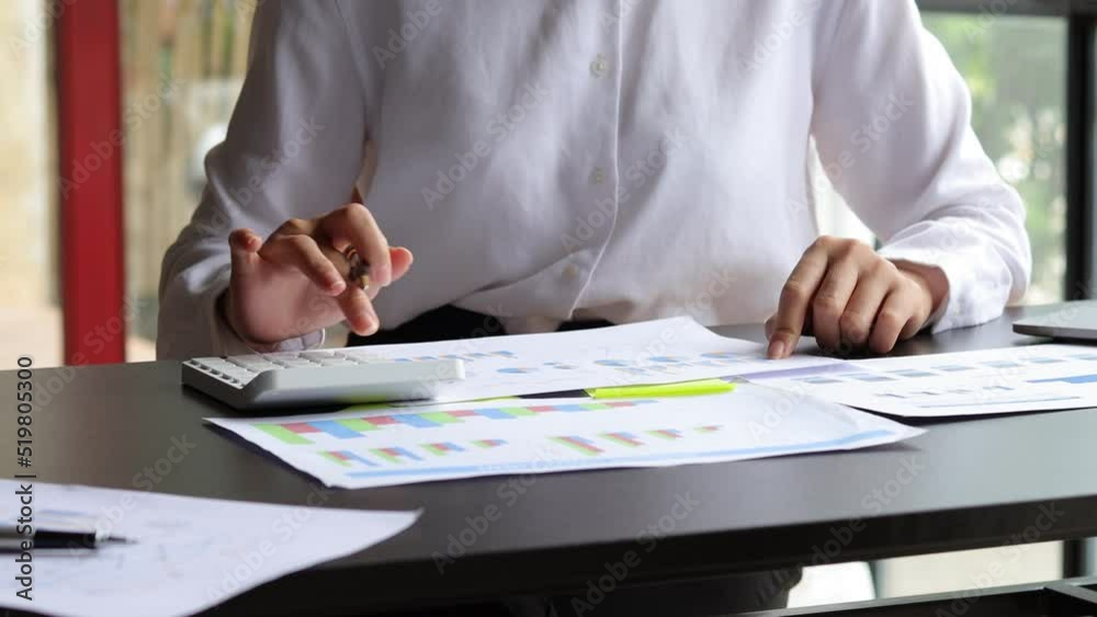 Accountant is doing audit work on the desk in the office, Analyzing ...