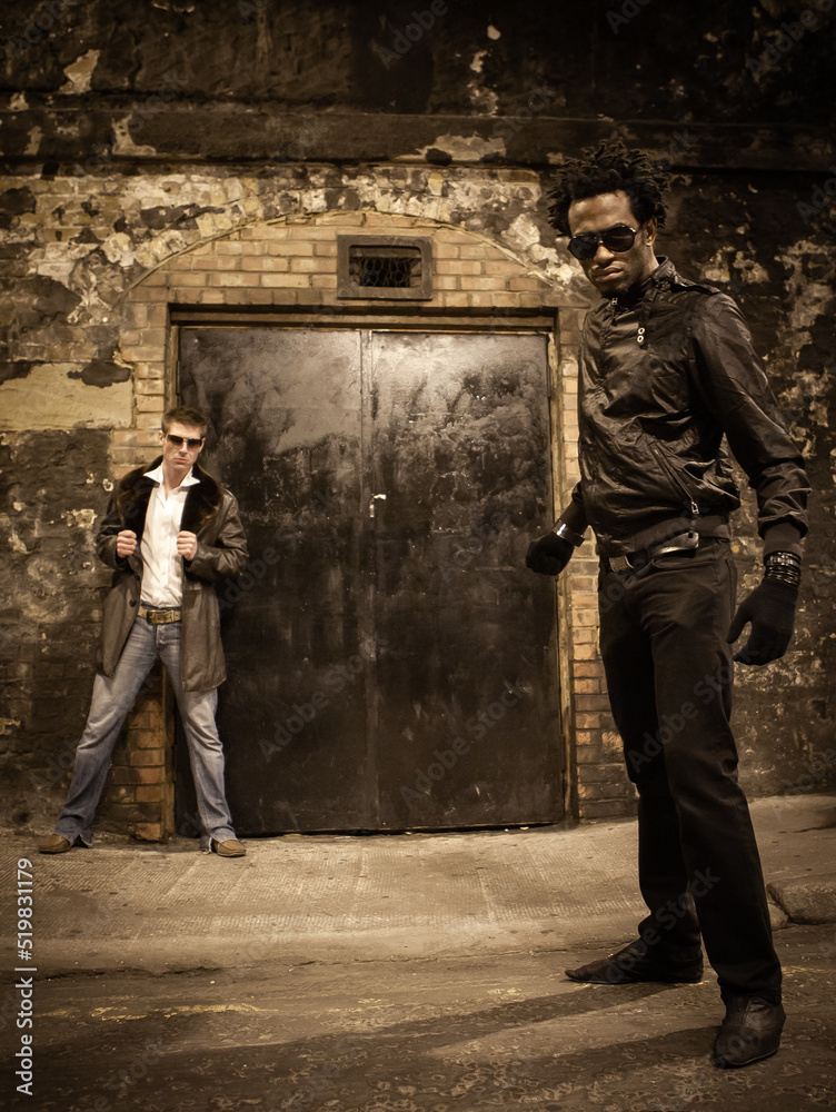 Door Security. A pair of nightclub security staff standing guard by an ...