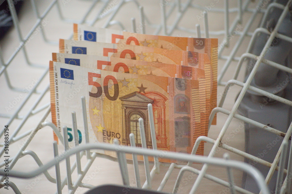 Banknotes in a dishwasher as a symbol of money washing Stock Photo ...