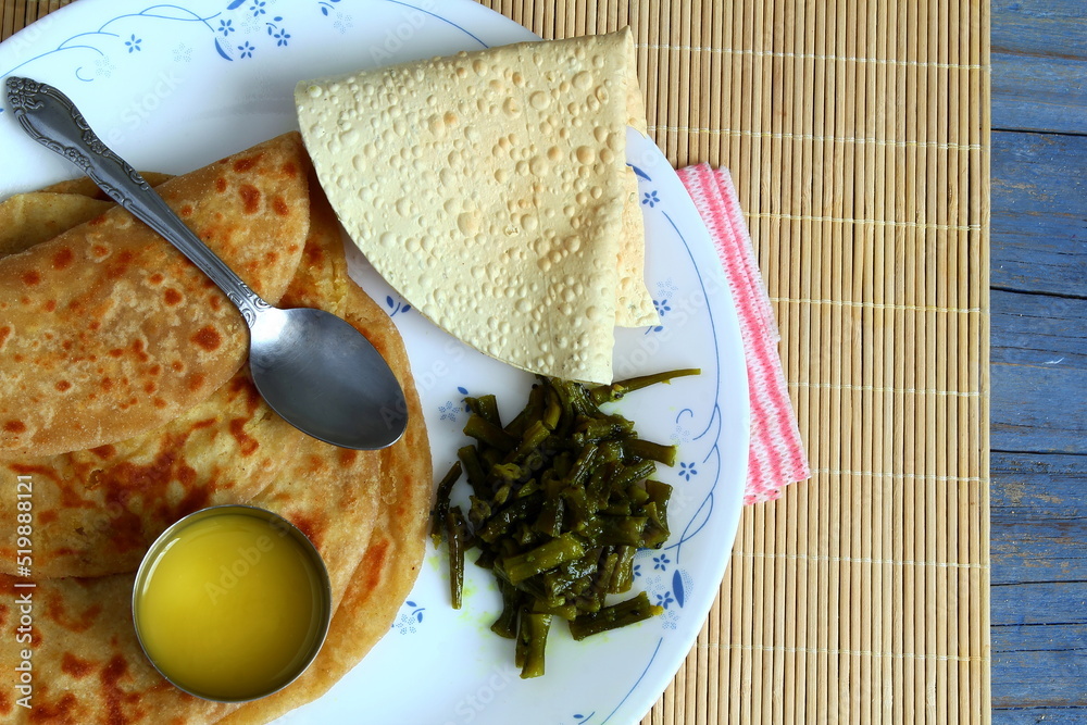 indian gujarati traditional sweet stuffed flatbread or sweet roti vedmi ...