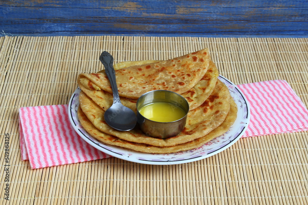 indian gujarati traditional sweet stuffed flatbread or sweet roti vedmi ...