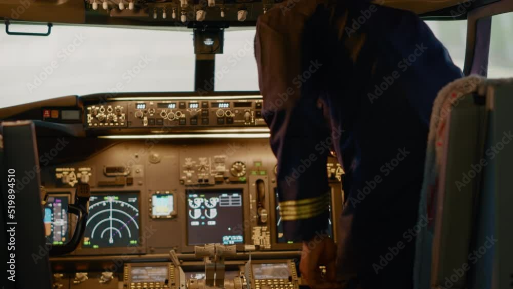 African american captain inserting destination coordinates to help ...