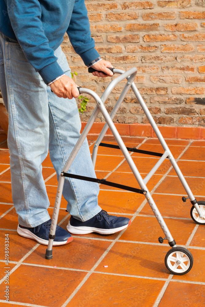 Man walking with walker Stock Photo | Adobe Stock