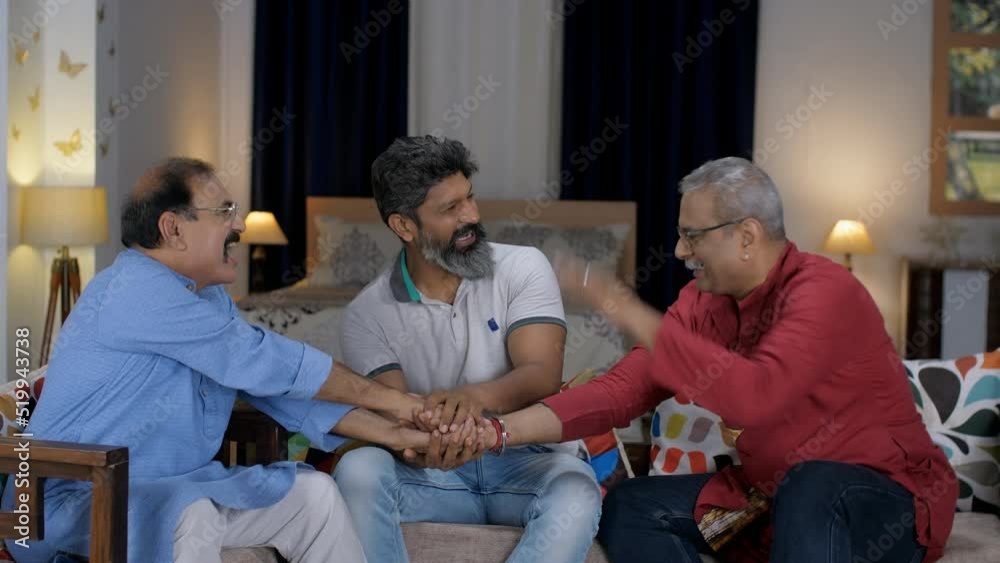 Three cheerful Indian friends thumping hands and celebrating - hotel ...