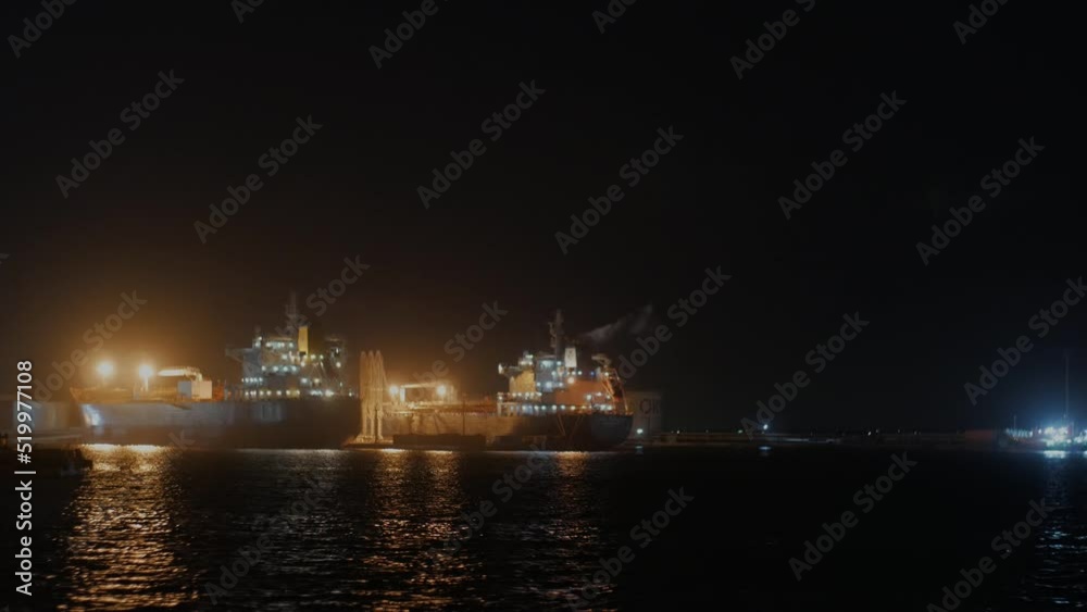 Night sighting of cargo ships docked at Autonomous Port of Dakar - Port ...