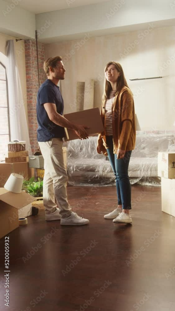 Vertical screen: Family New Home Moving in: Happy and Excited Young ...