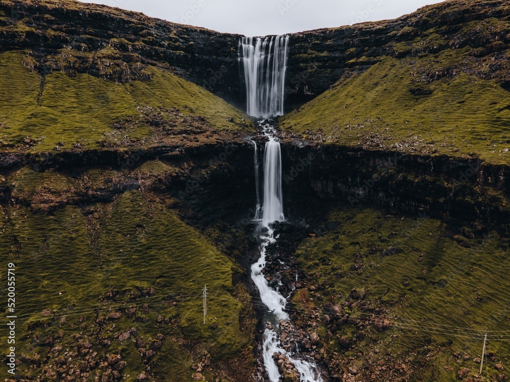 Foto de Fossa Waterfall as seen in the Faroe Islands do Stock | Adobe Stock