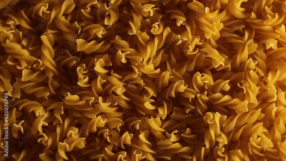 Uncooked Fusilli Pasta - Top View. Fat and Unhealthy Food. Dry Spiral ...