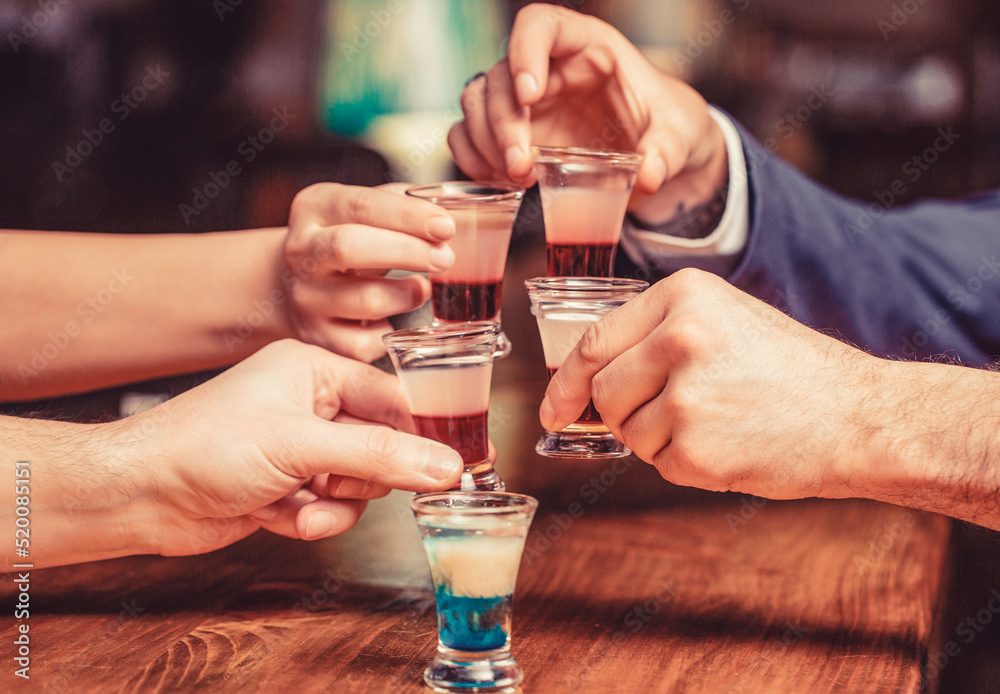 People Taking Shots Of Alcohol People Taking Shots Of Alcohol