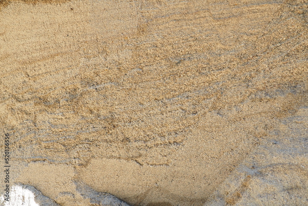 Sandstone is a fragmentary sedimentary rock, a homogeneous or layered ...