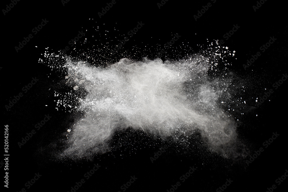White powder explosion cloud against black background.White dust ...