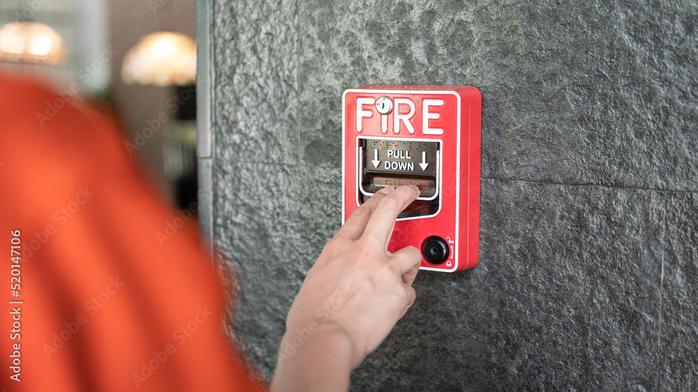 Activate fire alarm trigger system which is installed on granite wall ...