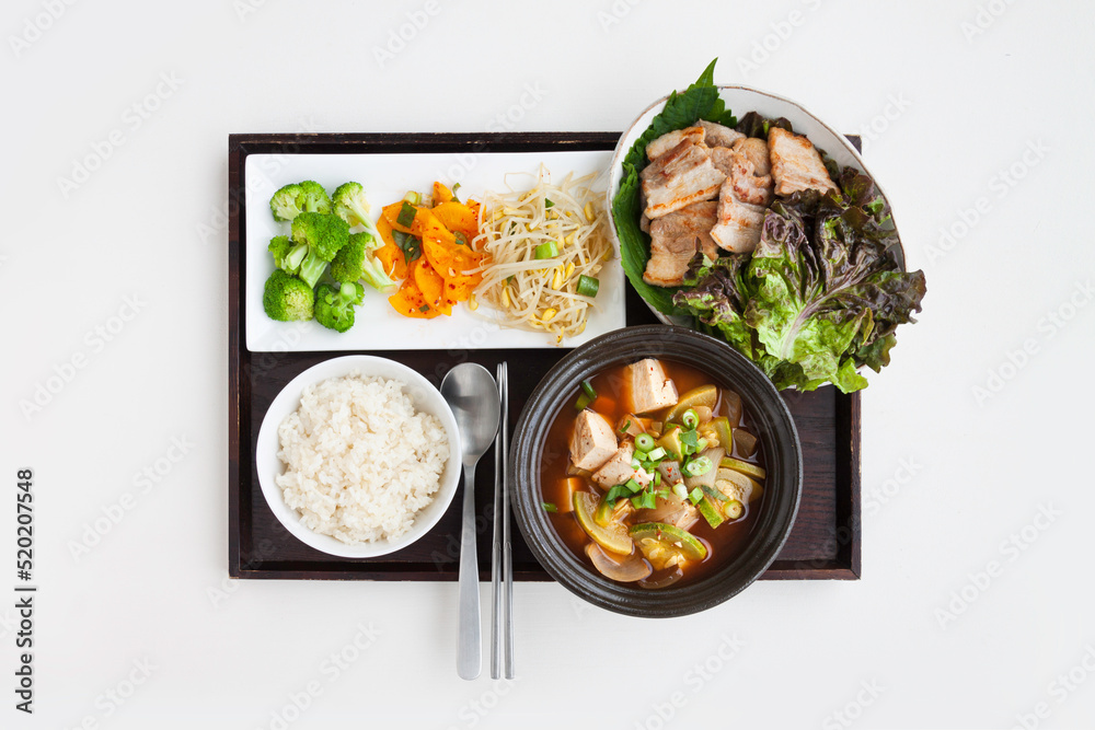 Rice and side dish dishes, the main Korean meal menu, are on a tray ...