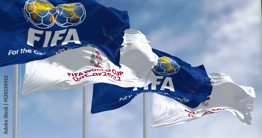 Flags with FIFA and Qatar 2022 World Cup logo waving in the wind Stock ...