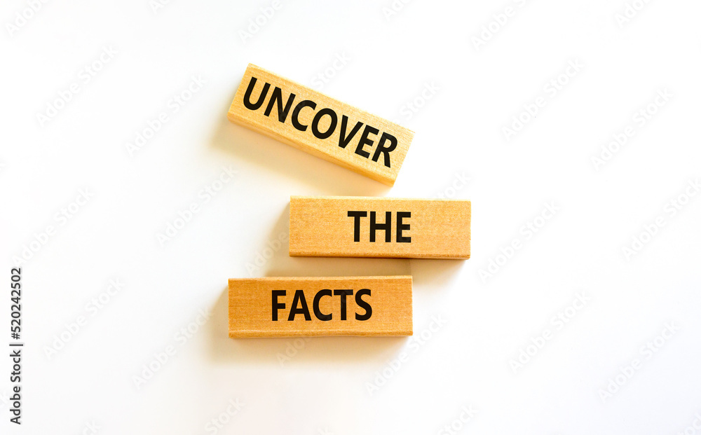 Uncover the facts symbol. Concept words Uncover the facts on wooden ...