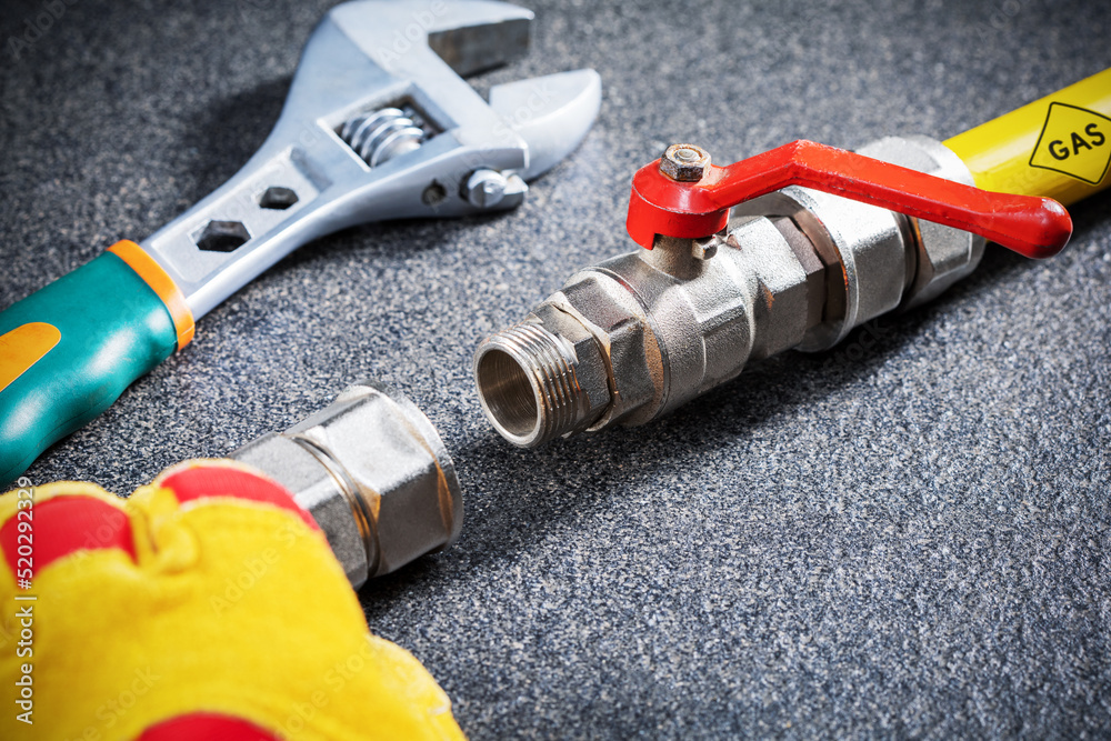 Maintenance of the gas pipeline. Male hand in glove hold gas pipe and ...