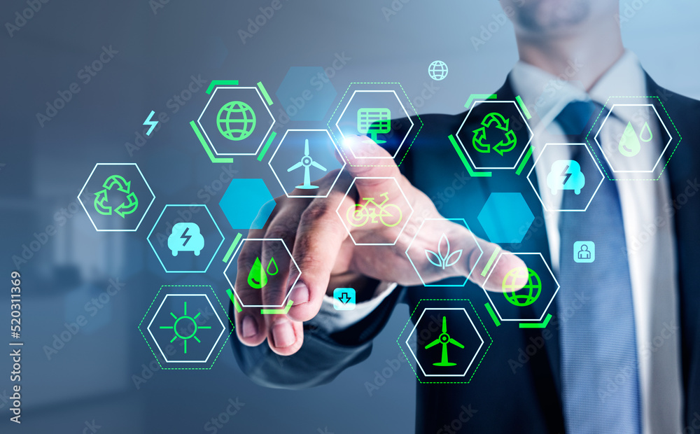 Businessman finger touch green energy digital hud icons, technology and ...