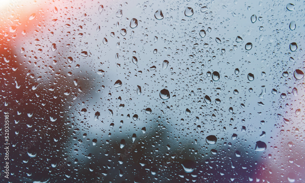 Sun after rain. Drops on glass. It's been raining. Texture on glass ...