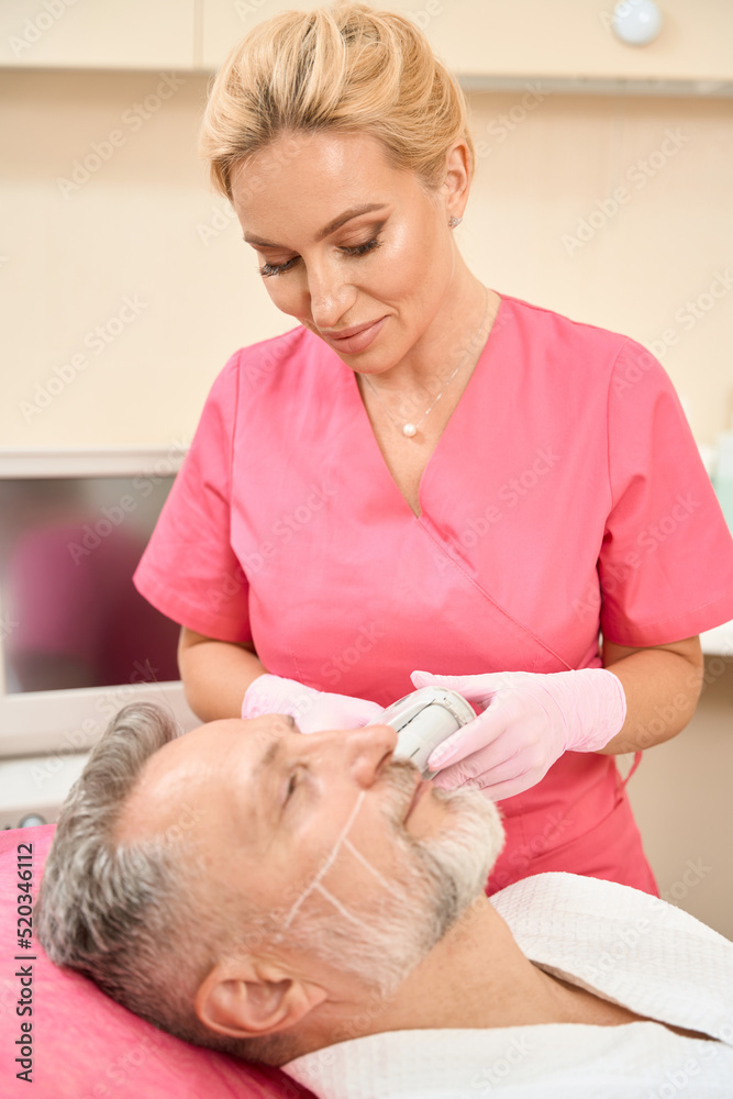 Beautiful woman dermatologist doing ultrasound facelift smas lifting ...