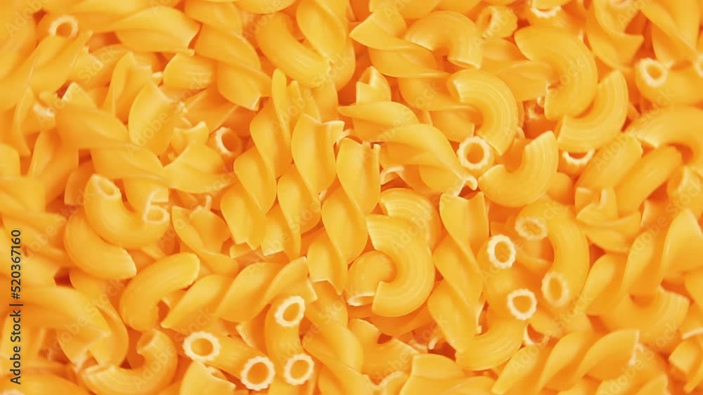 Vidéo Stock Uncooked Fusilli and Chifferi Rigati Pasta - Top View. Fat ...
