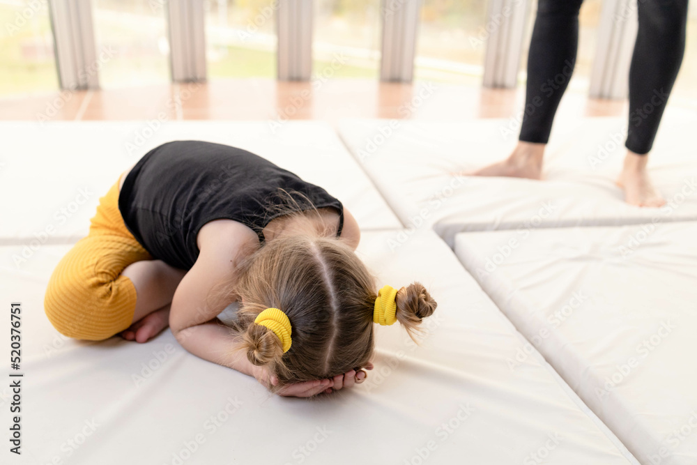 Poster Little girl misbehaving while her mother standing beside her ...