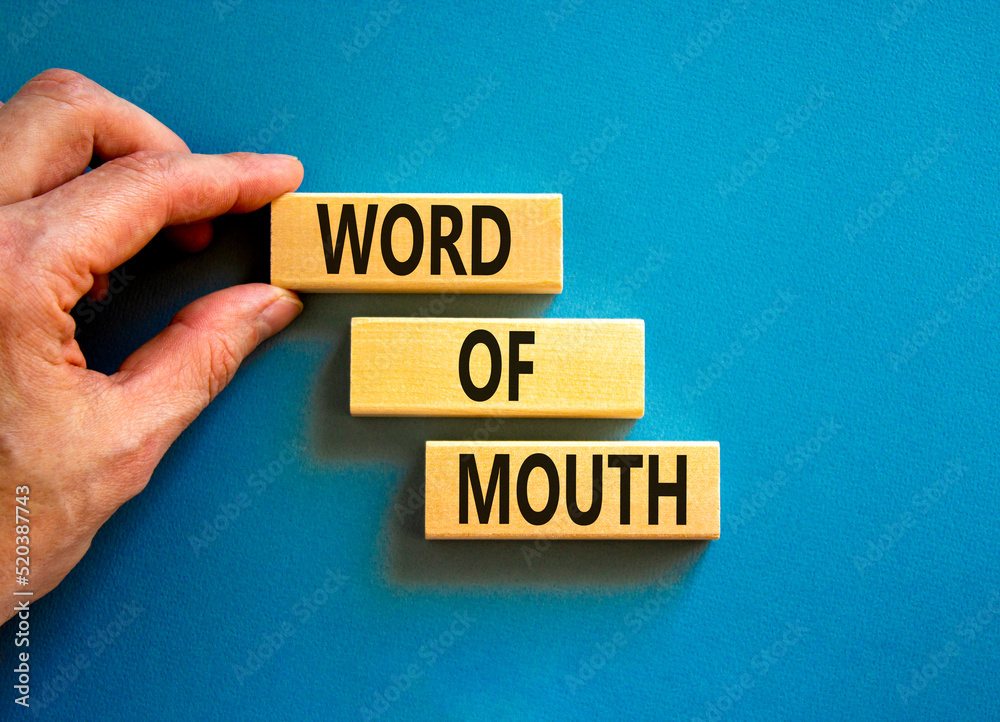 Word of mouth symbol. Concept words Word of mouth on wooden blocks on a ...