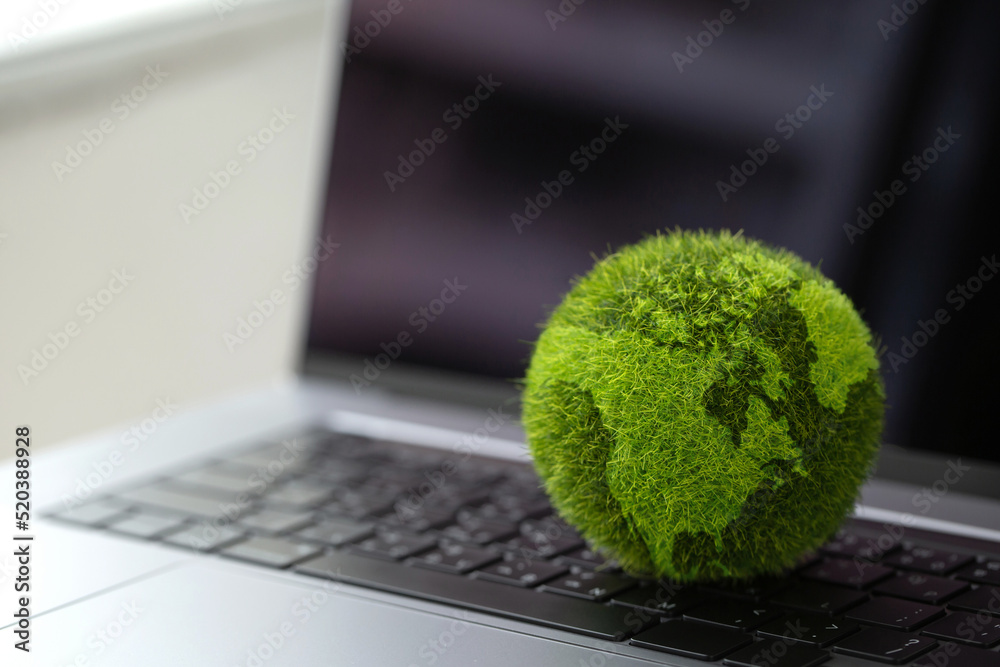 Technology with nature concept.Laptop keyboard with Green Globe on it ...