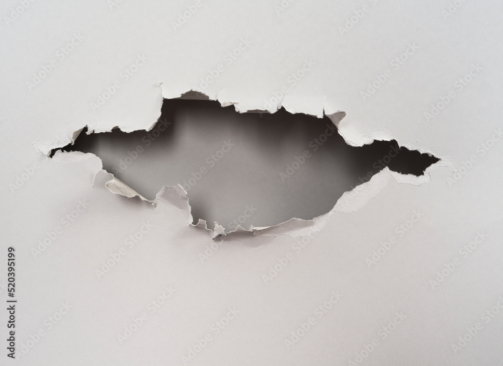 ripped hole in paper background Stock Photo | Adobe Stock