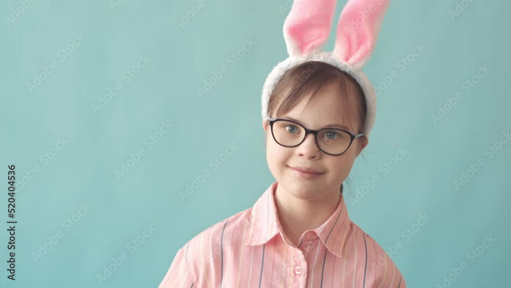 Chest up studio portrait of 12 year old Caucasian girl with down ...