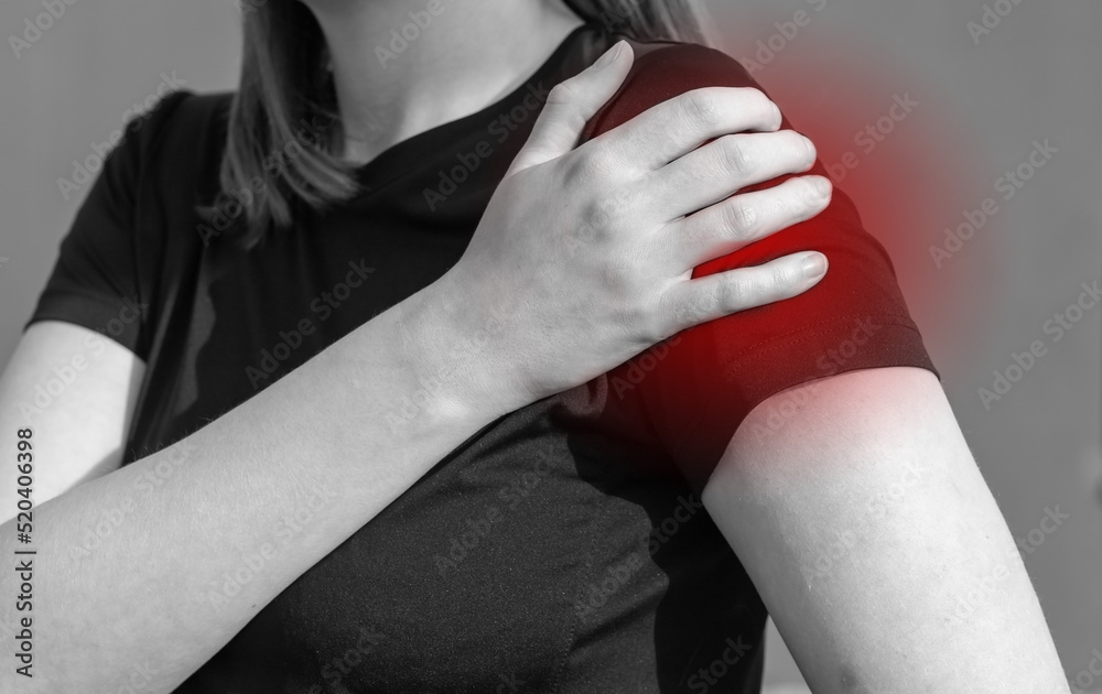 Woman touching painful shoulder with red point. Arm ache, swelling ...