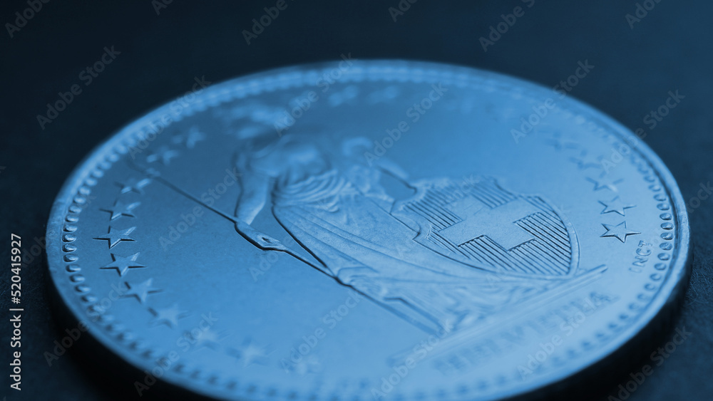 1 Swiss Franc coin closeup. Blue tinted background or wallpaper about ...