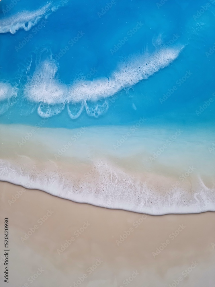 Summer sandy beach drawing by epoxy resin. Top view on ocean wave with ...