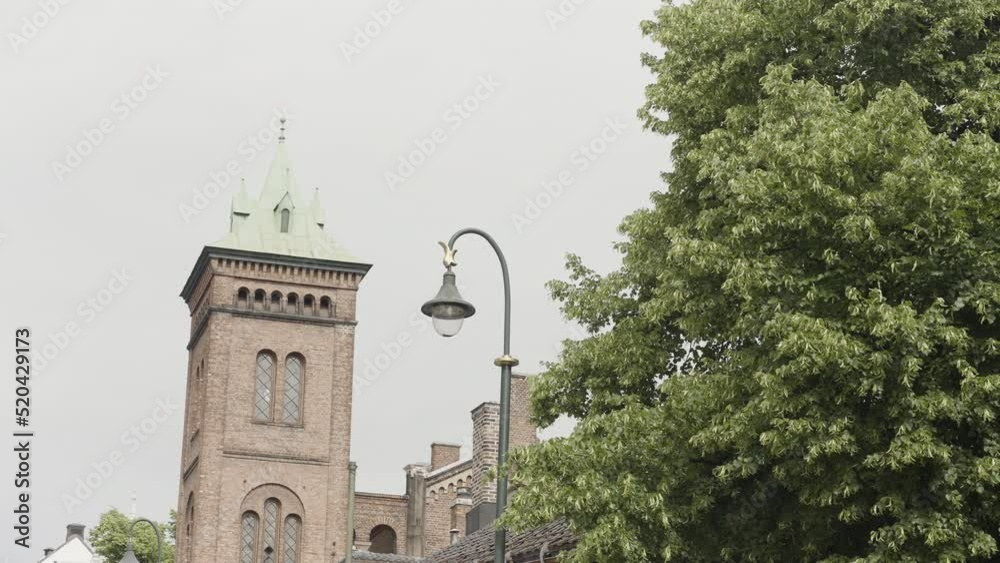 Big red castle. Action.A bright huge monument building standing next to ...