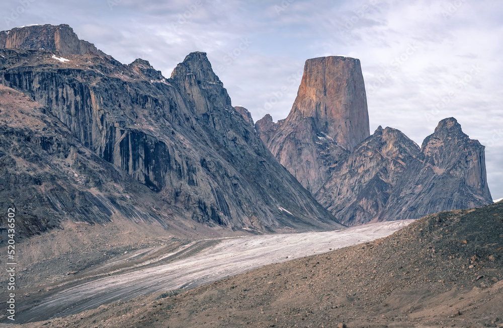 Iconic granite rock of Mt.Asgard towers above Turner glacier in remote ...