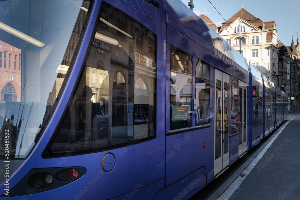 BASEL, SWITZERLAND - JULY 10 2022: Side view of a blue electric tram ...
