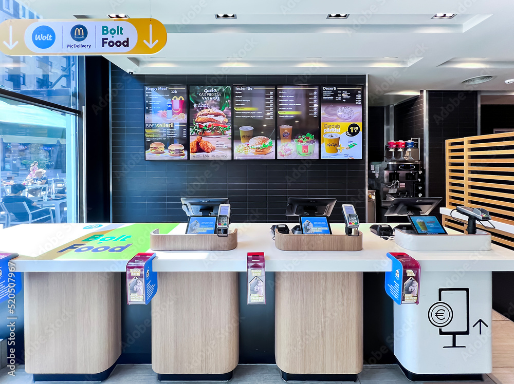 LATVIA, RIGA, JULY, 2022 - McDonalds counter with menu of different ...