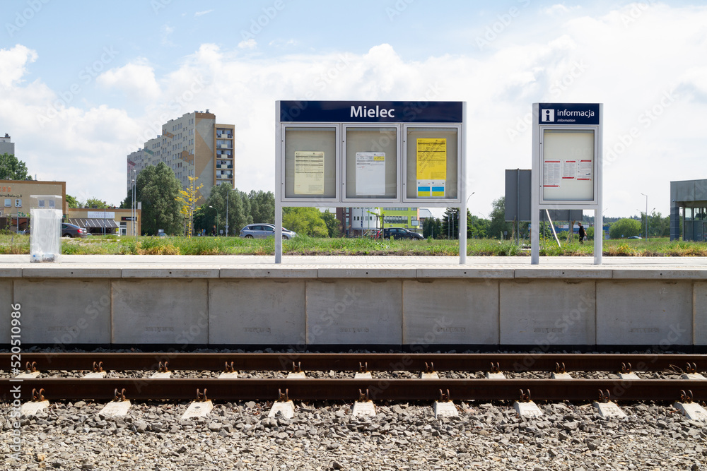 Railway train station with name sign of Mielec city on a platform on ...