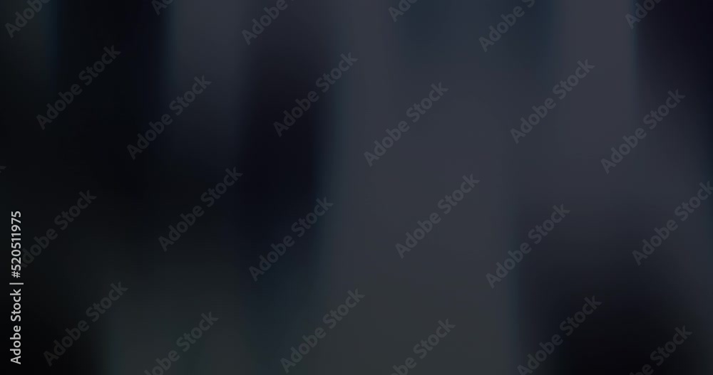 Dark black background with light shades and rays of light. Loop ...