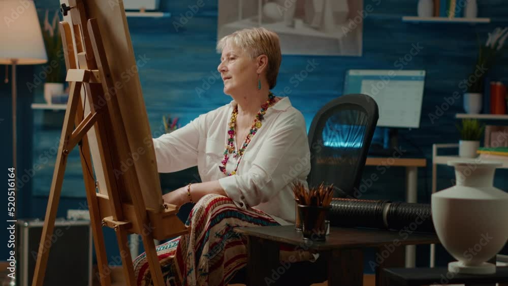 Senior person drawing masterpiece with authentic model, creating ...