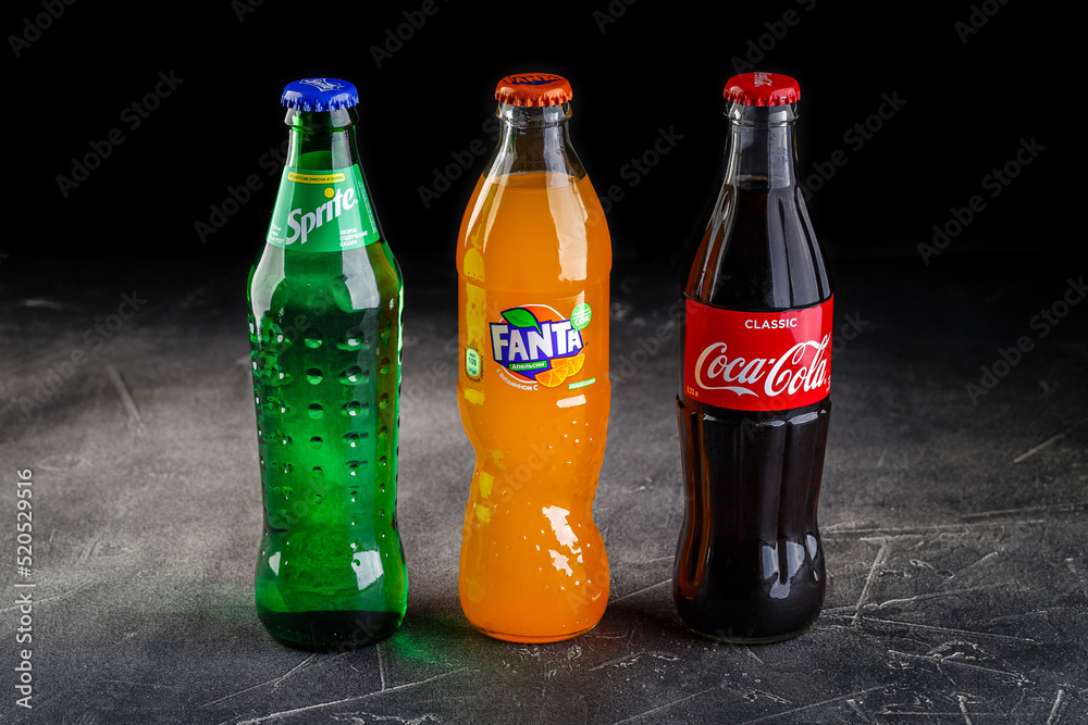 Glass bottles of Coca Cola and Fanta and Sprite soft drink. Stock Photo ...