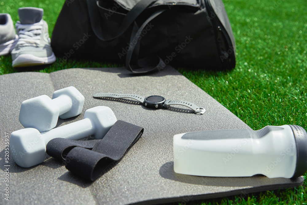 Sport items, fitness smart watches and running sneakers on gray ...