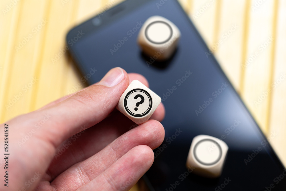 Simple question mark cube abstract object near a smartphone, mobile ...