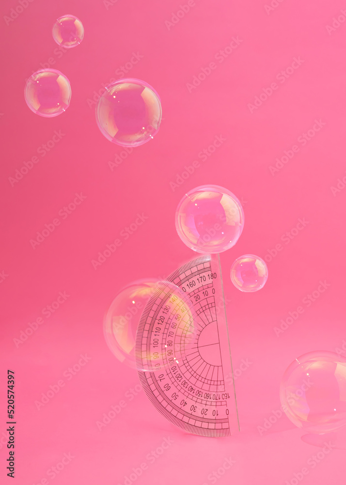 School protractor flying with transparent balloons. Pink dreamy ...