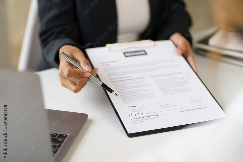 New graduate woman filling out an application form for HR department ...